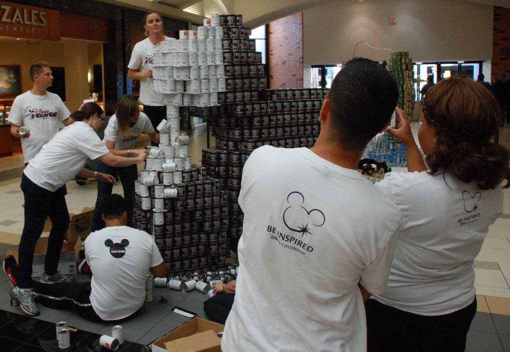 Disney VoluntEARS Create Can Sculpture for Food Bank - LaughingPlace.com
