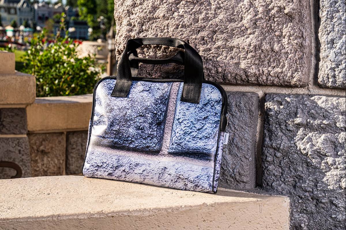 Disneyland Paris Launches Upcycled Bag Collection Made From Sleeping Beauty Castle Tarp
