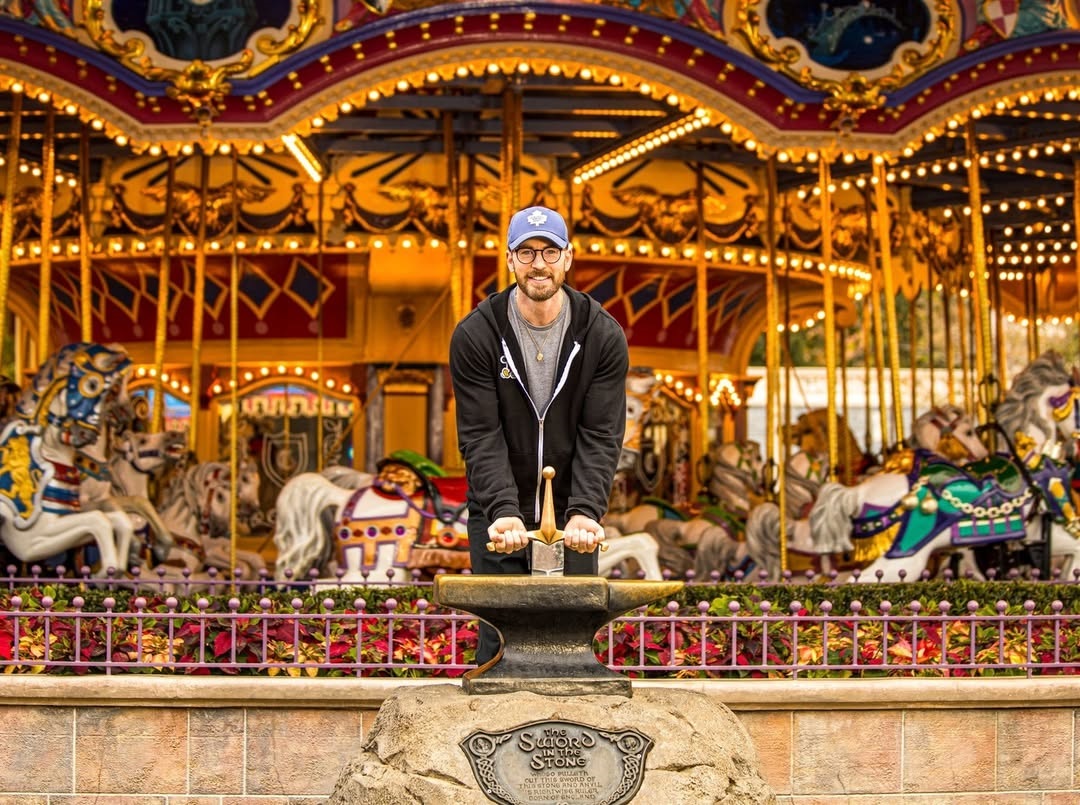 Chris Evans Pulls the Sword from the Stone at the Magic Kingdom ...